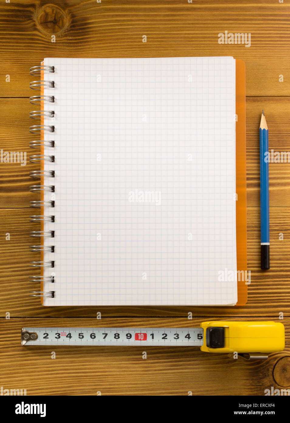 tape measure and pencil on wooden texture Stock Photo - Alamy