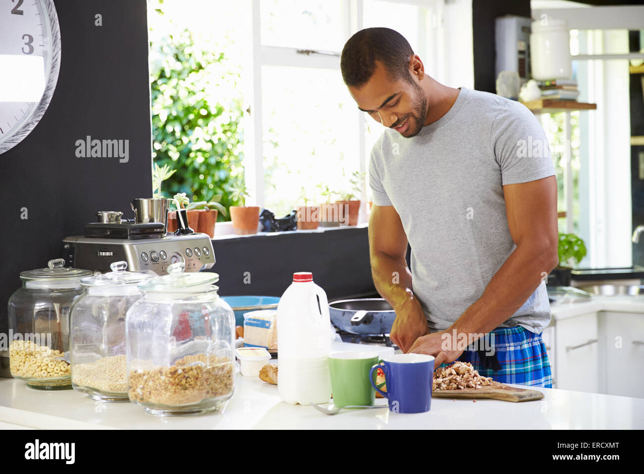 Man making breakfast cereal hi-res stock photography and images - Alamy