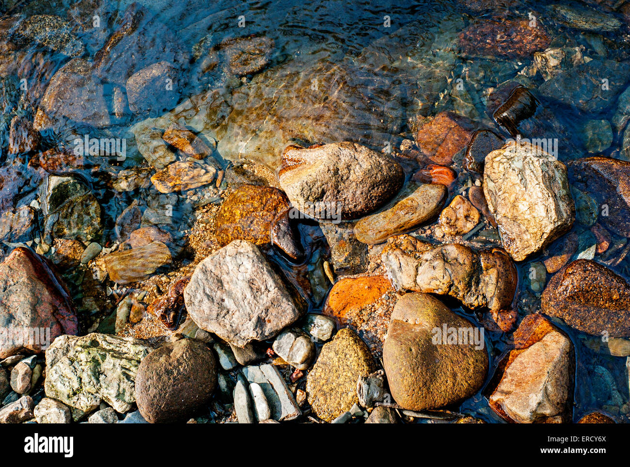 Golden rocks by river, light wave and translucent water, wave, bottom ...