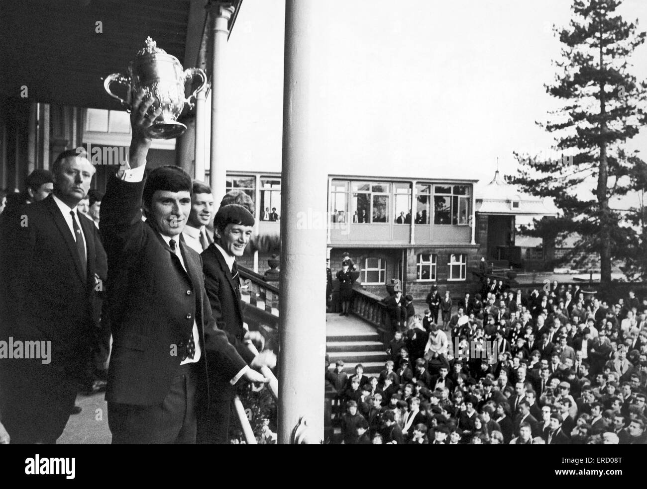 Derby County footballer Kevin Hector proudly holds aloft the Division ...