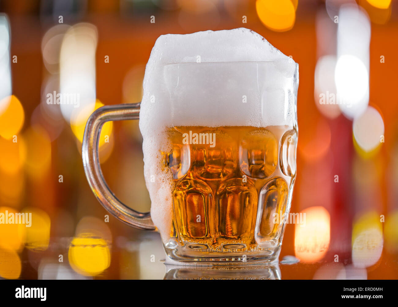 Bottle of beer with glass on bar desk, close-up Stock Photo - Alamy