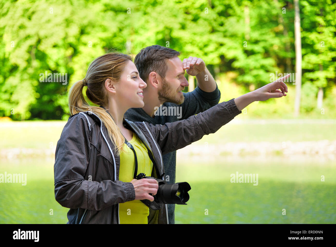 Happy couple tourists in nature Stock Photo - Alamy