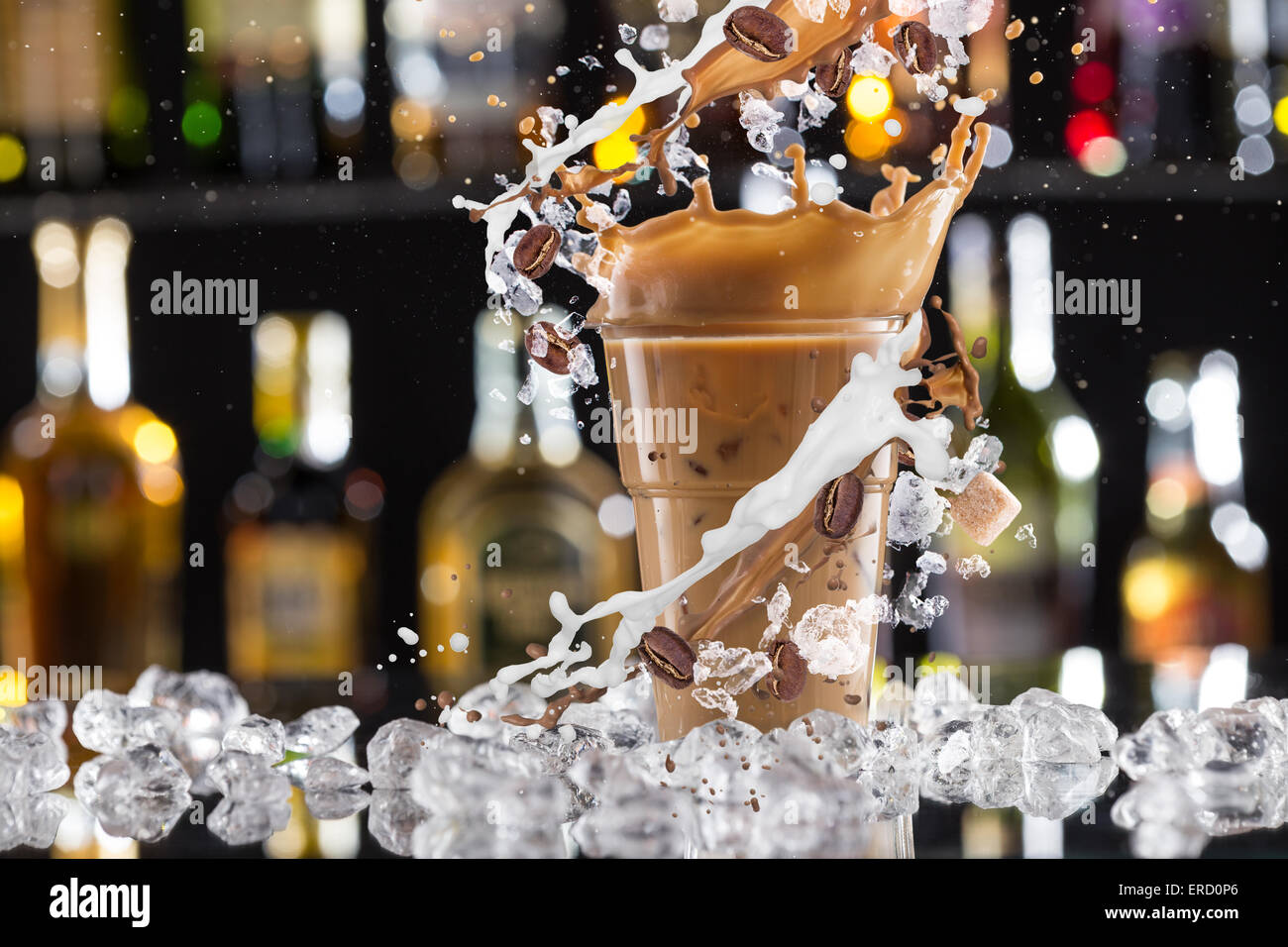 Cold coffee drink with ice, beans and splash, close-up Stock Photo - Alamy