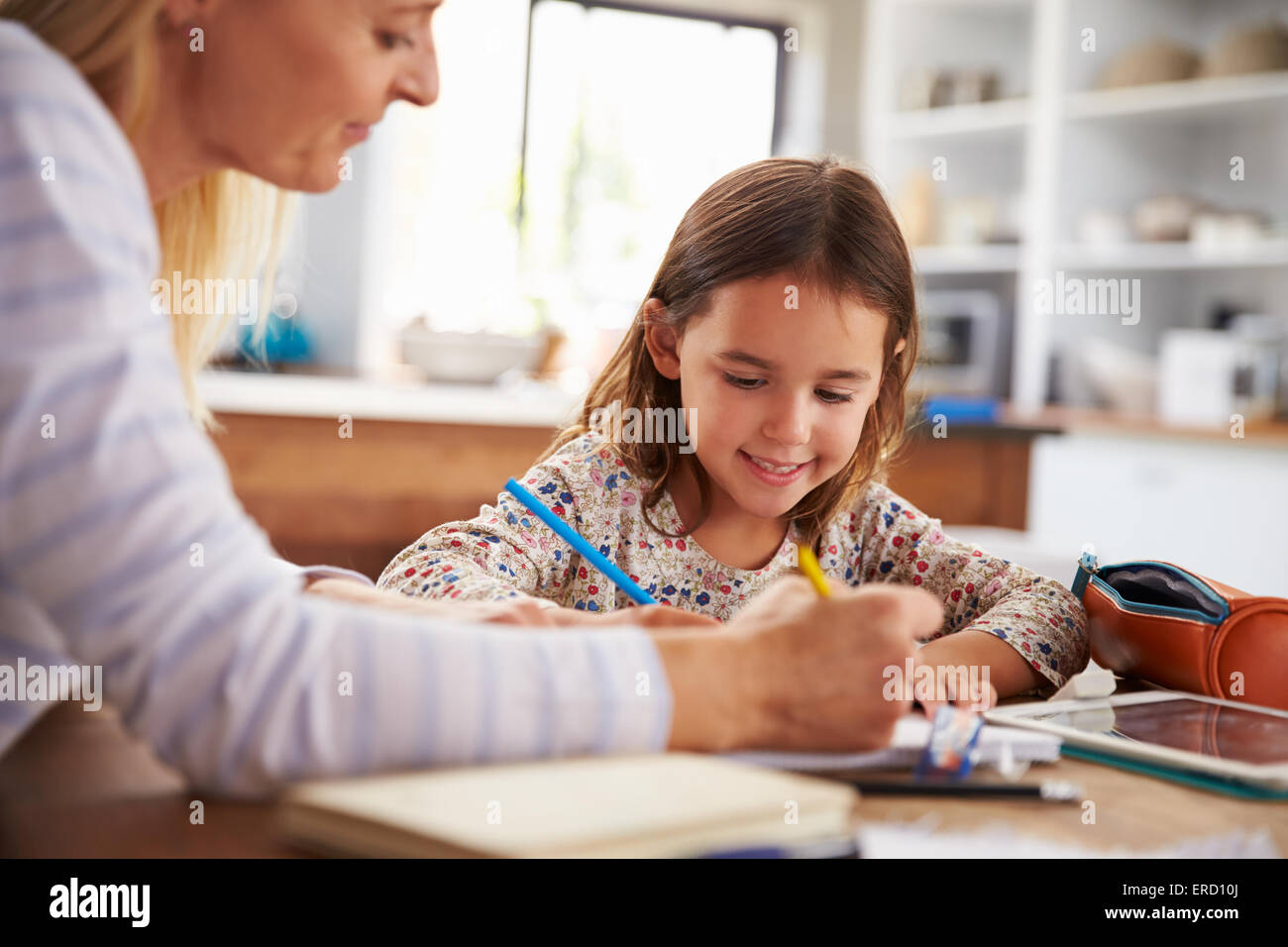 Mother teaching her daughter at home Stock Photo - Alamy Mother teaching her daughter at home Stock Photo - Alamy