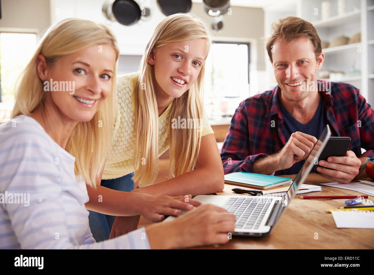 Daughter helping her parents with new technology Stock Photo - Alamy