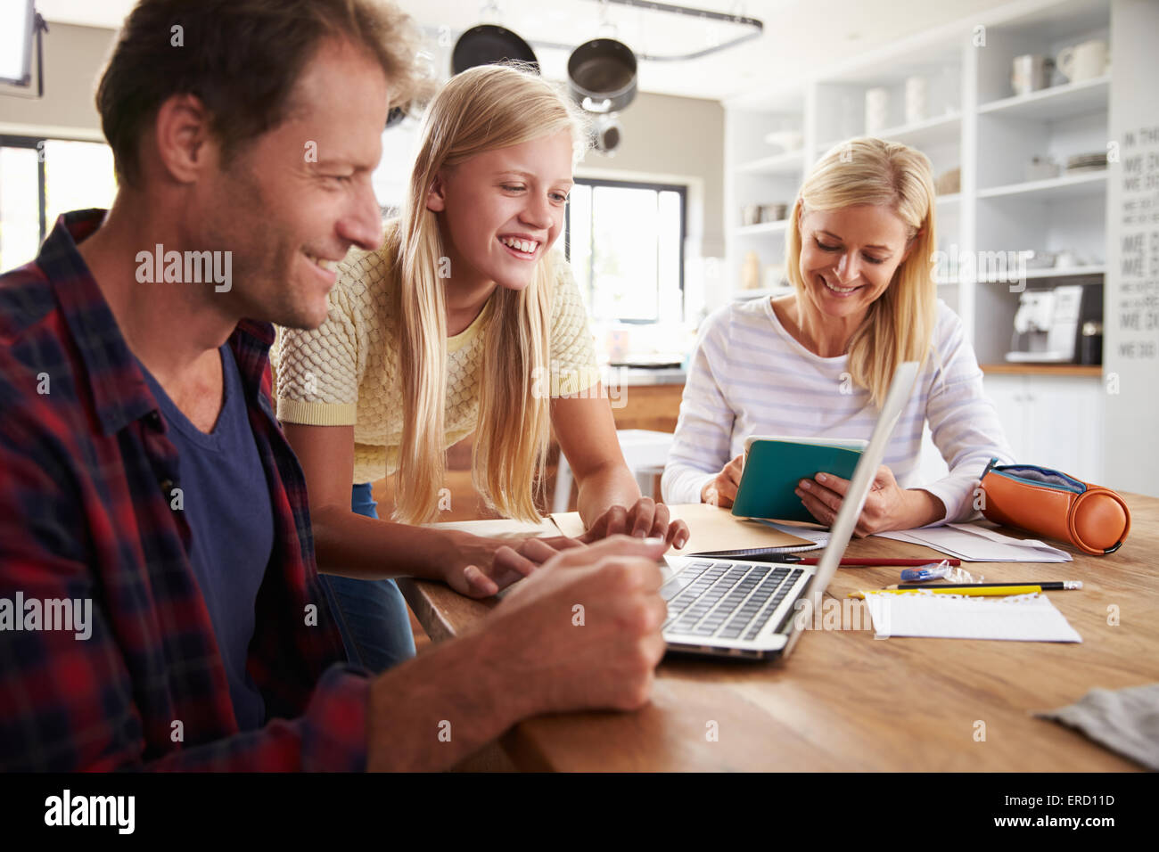Daughter helping her parents with new technology Stock Photo - Alamy
