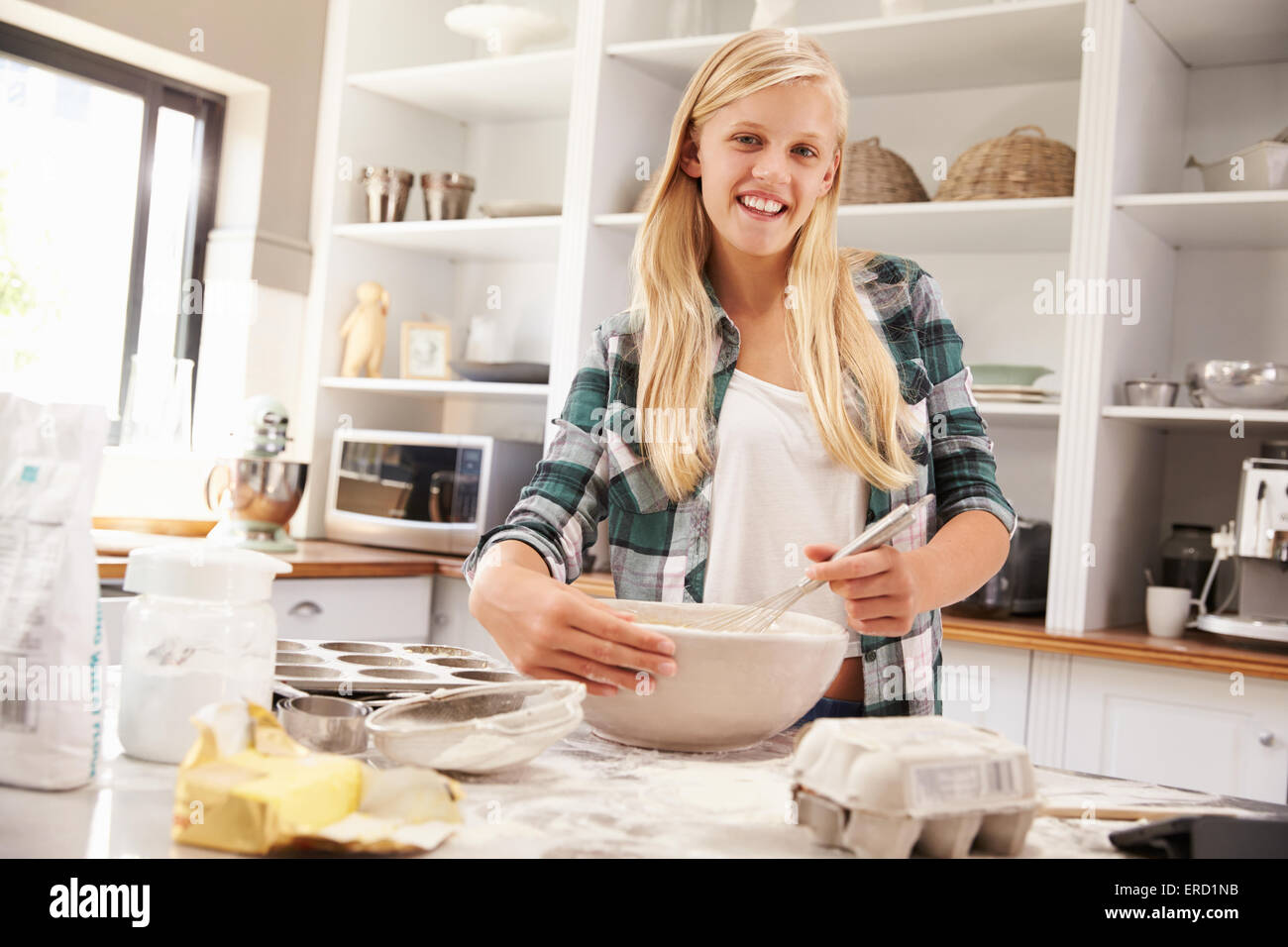 Young girl baking at home Stock Photo - Alamy