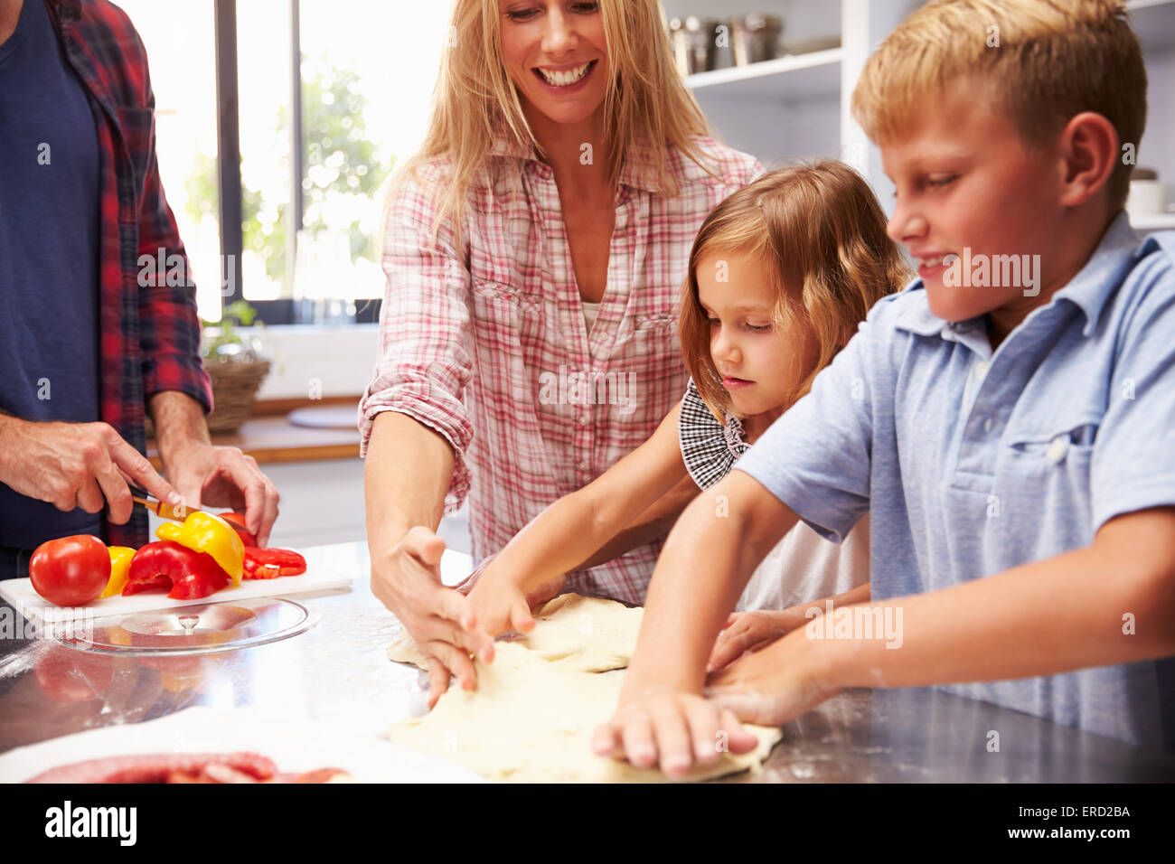 Family making pizza together Stock Photo - Alamy