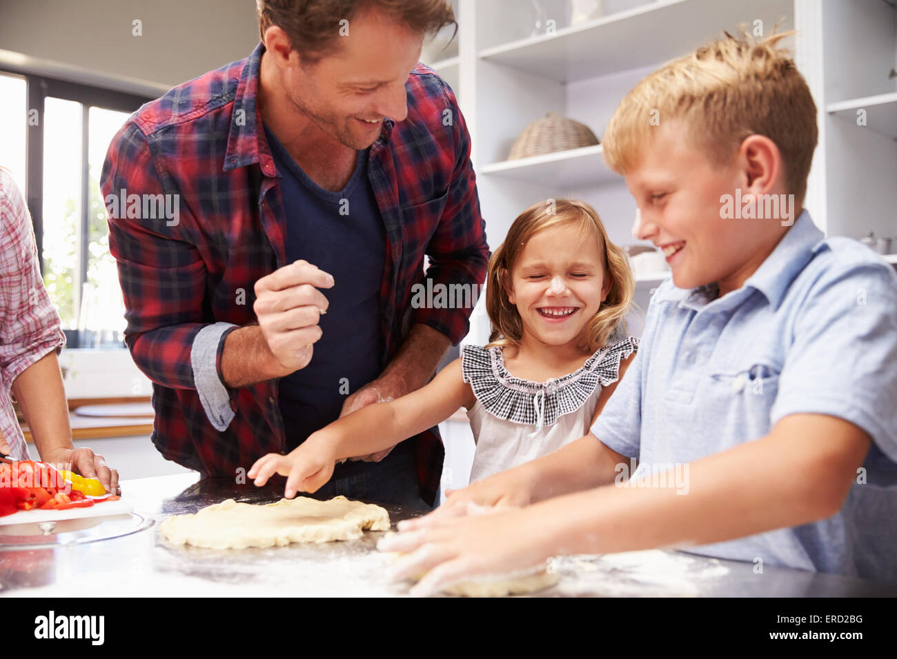 Father making pizza with kids Stock Photo - Alamy