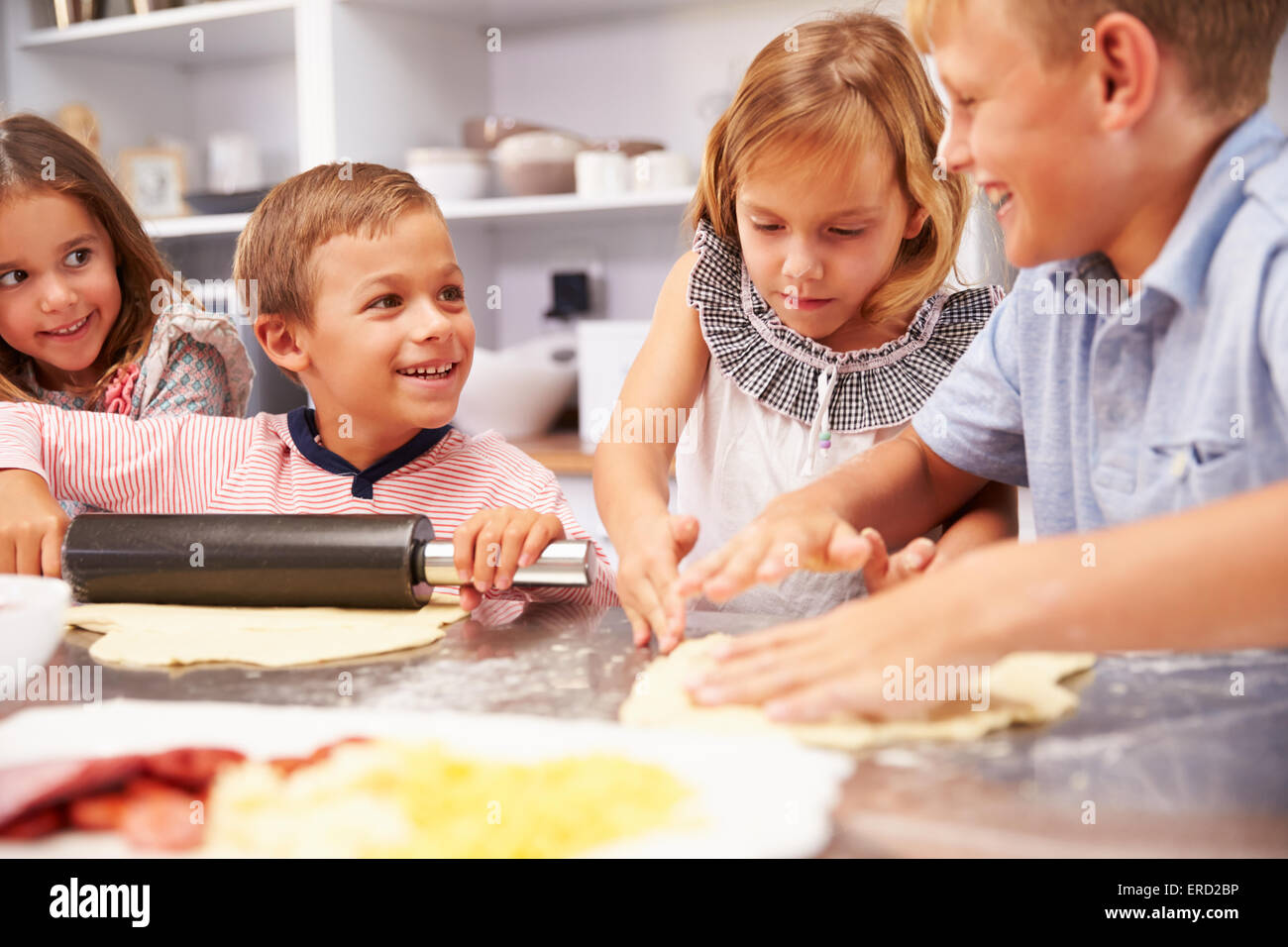 Children making pizza together Stock Photo - Alamy