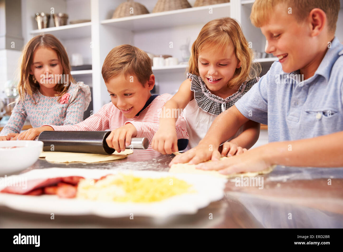 Children making pizza together Stock Photo - Alamy