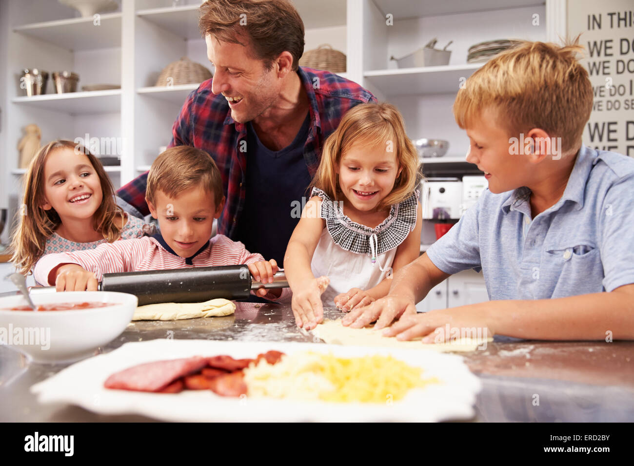 Father making pizza with his kids Stock Photo - Alamy
