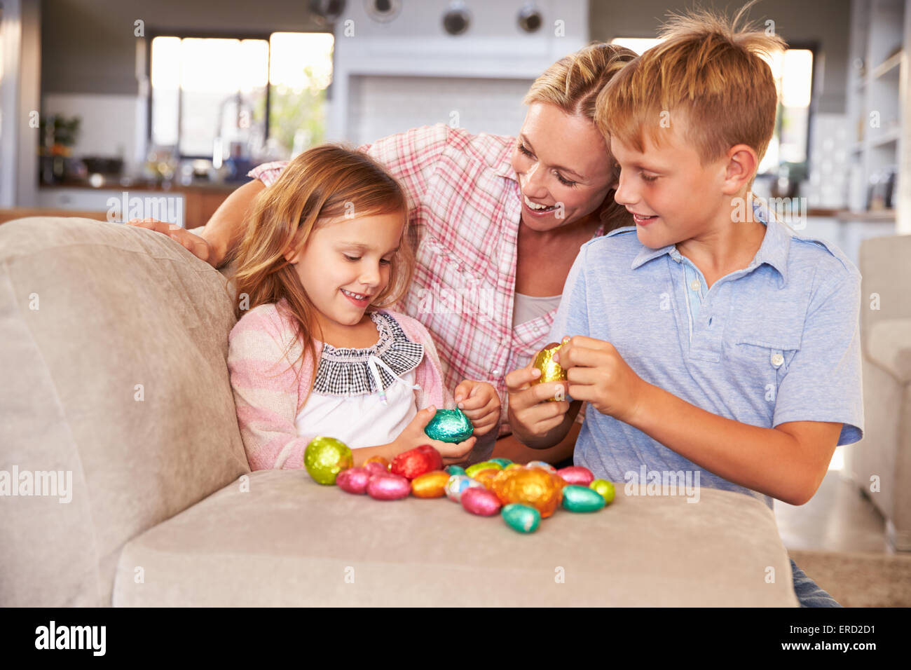 Mother celebrating Easter at home with kids Stock Photo - Alamy
