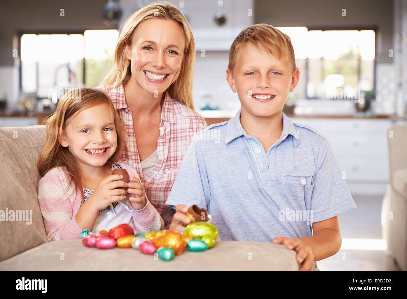 Mother celebrating Easter at home with kids Stock Photo - Alamy