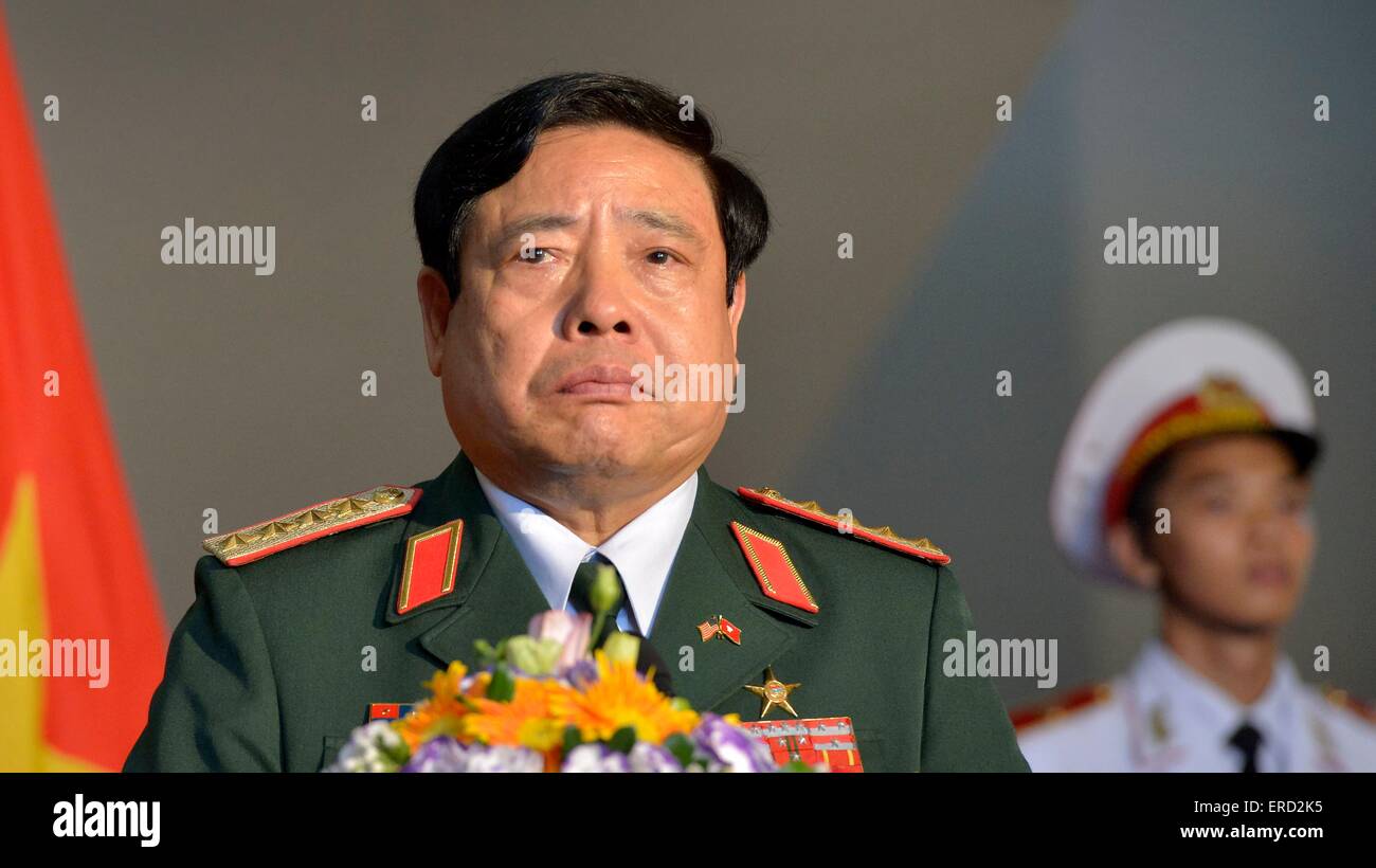 Vietnamese Minister of Defense General Phung Quang Thanh pauses quietly ...