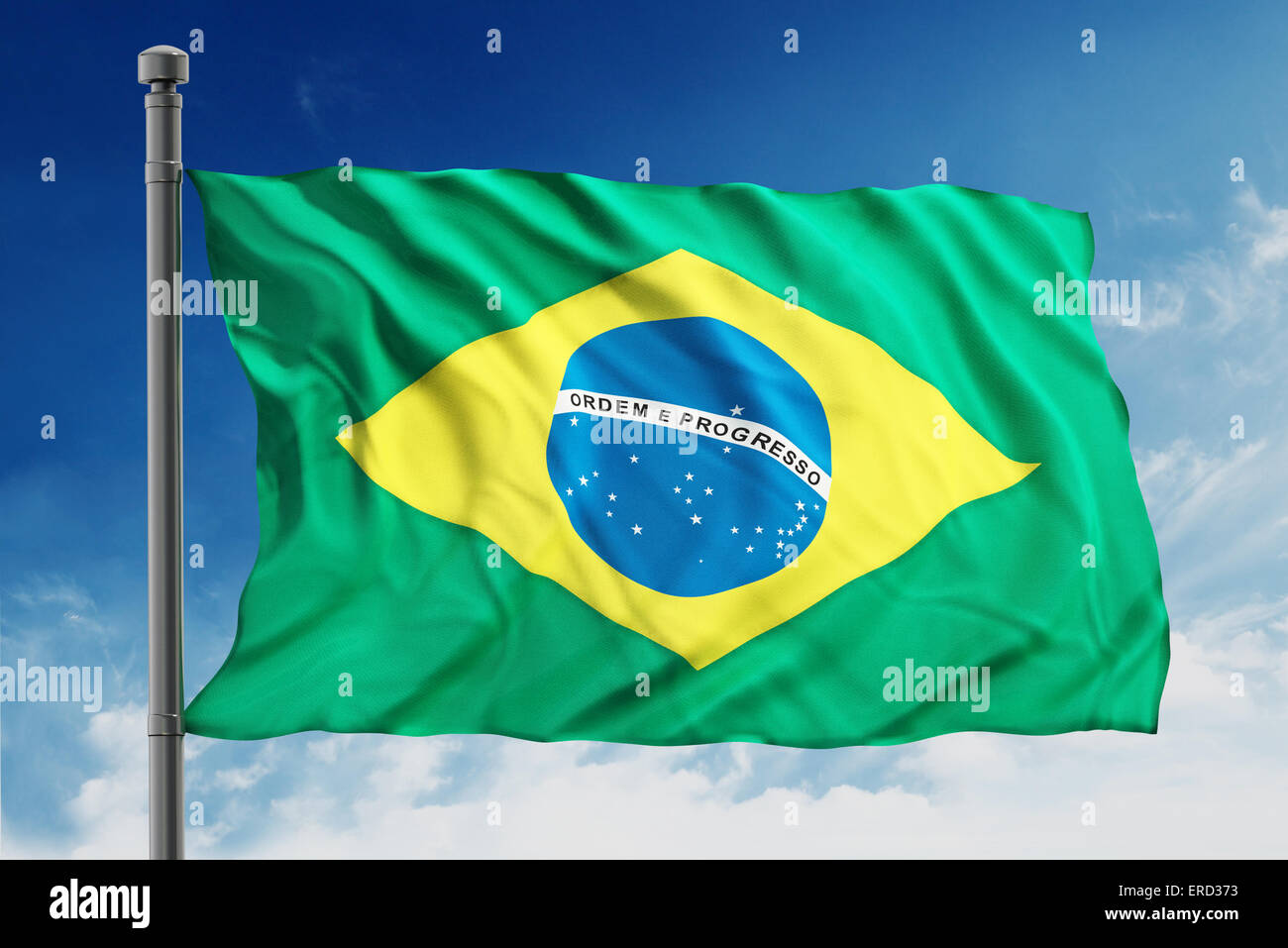 Brazilian flag on blue sky Stock Photo - Alamy