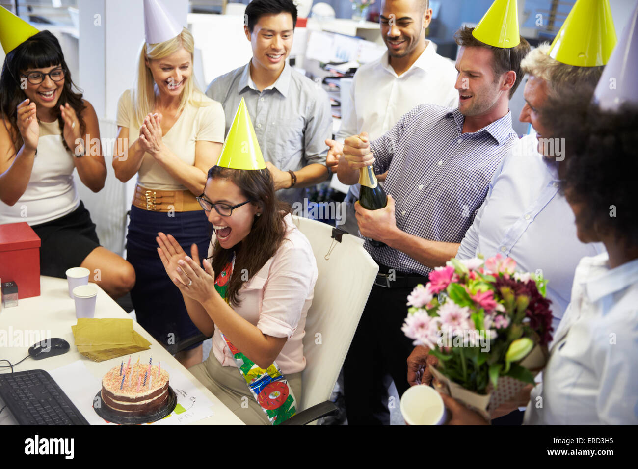 Celebrating a colleague's birthday in the office Stock Photo - Alamy