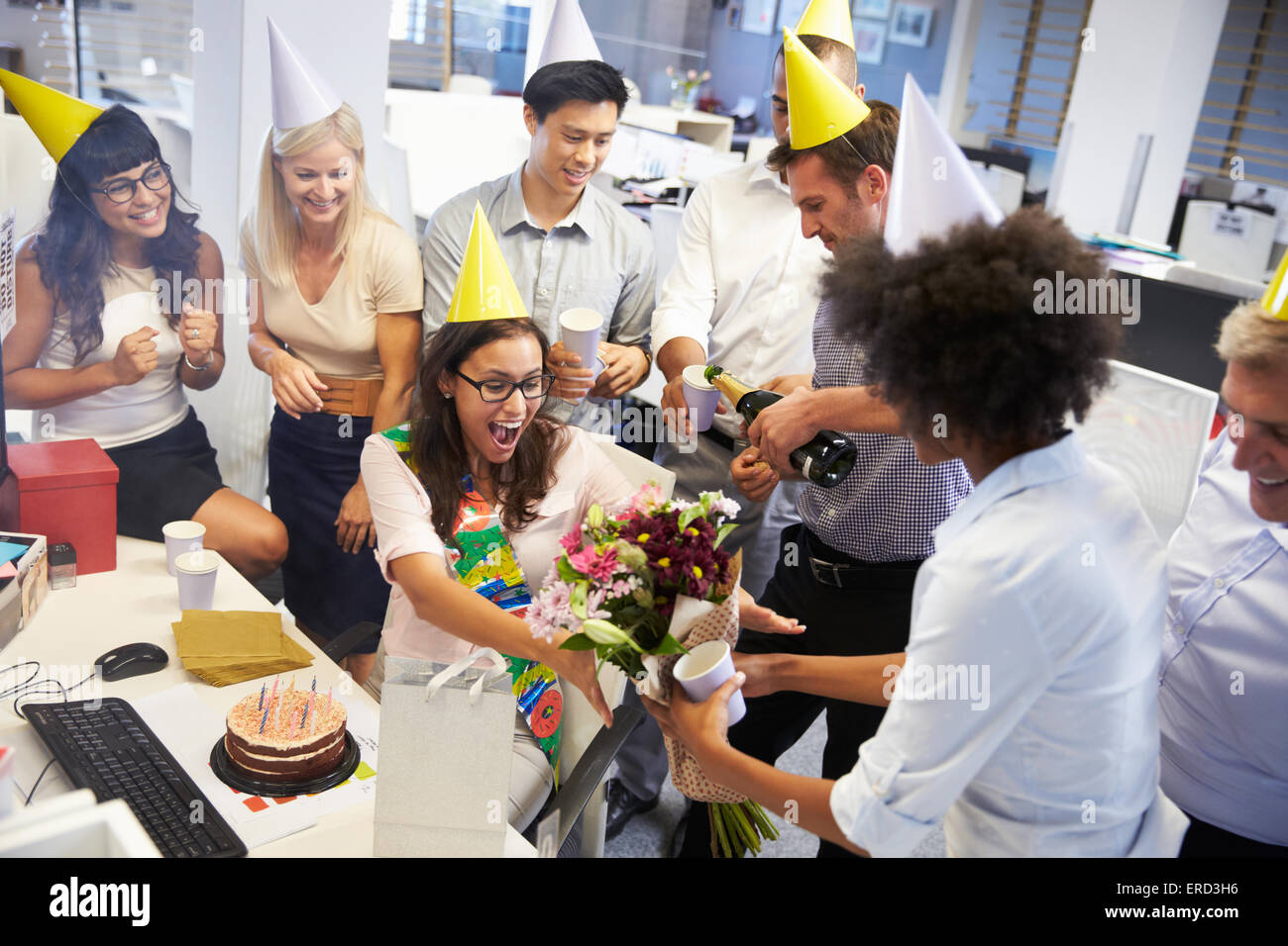 Celebrating a colleague's birthday in the office Stock Photo - Alamy