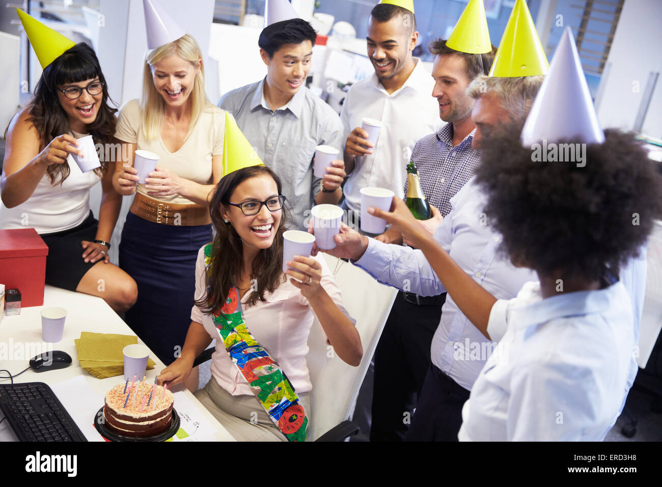 Celebrating a colleague's birthday in the office Stock Photo - Alamy