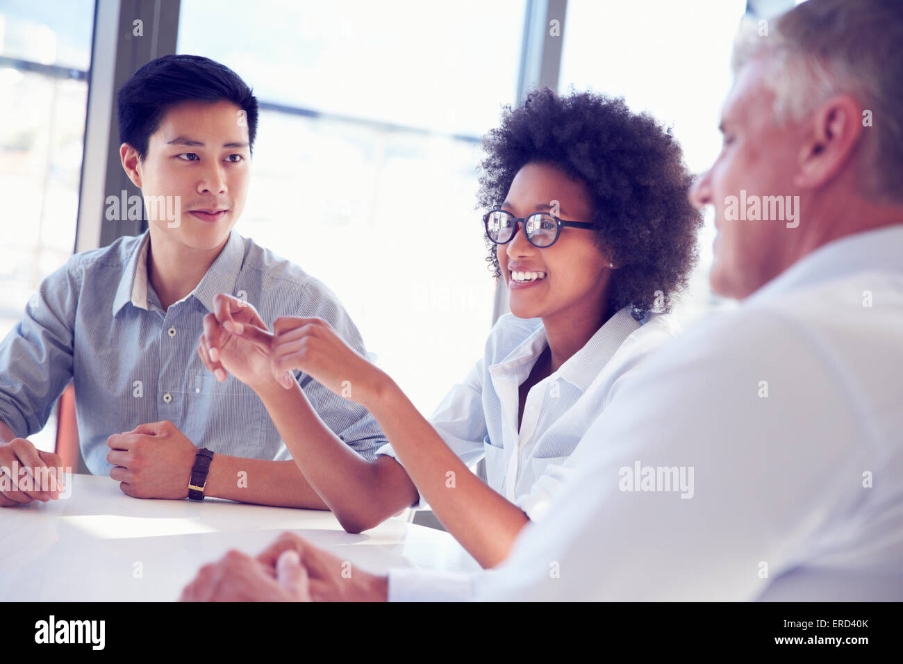 Three business professionals working together Stock Photo - Alamy
