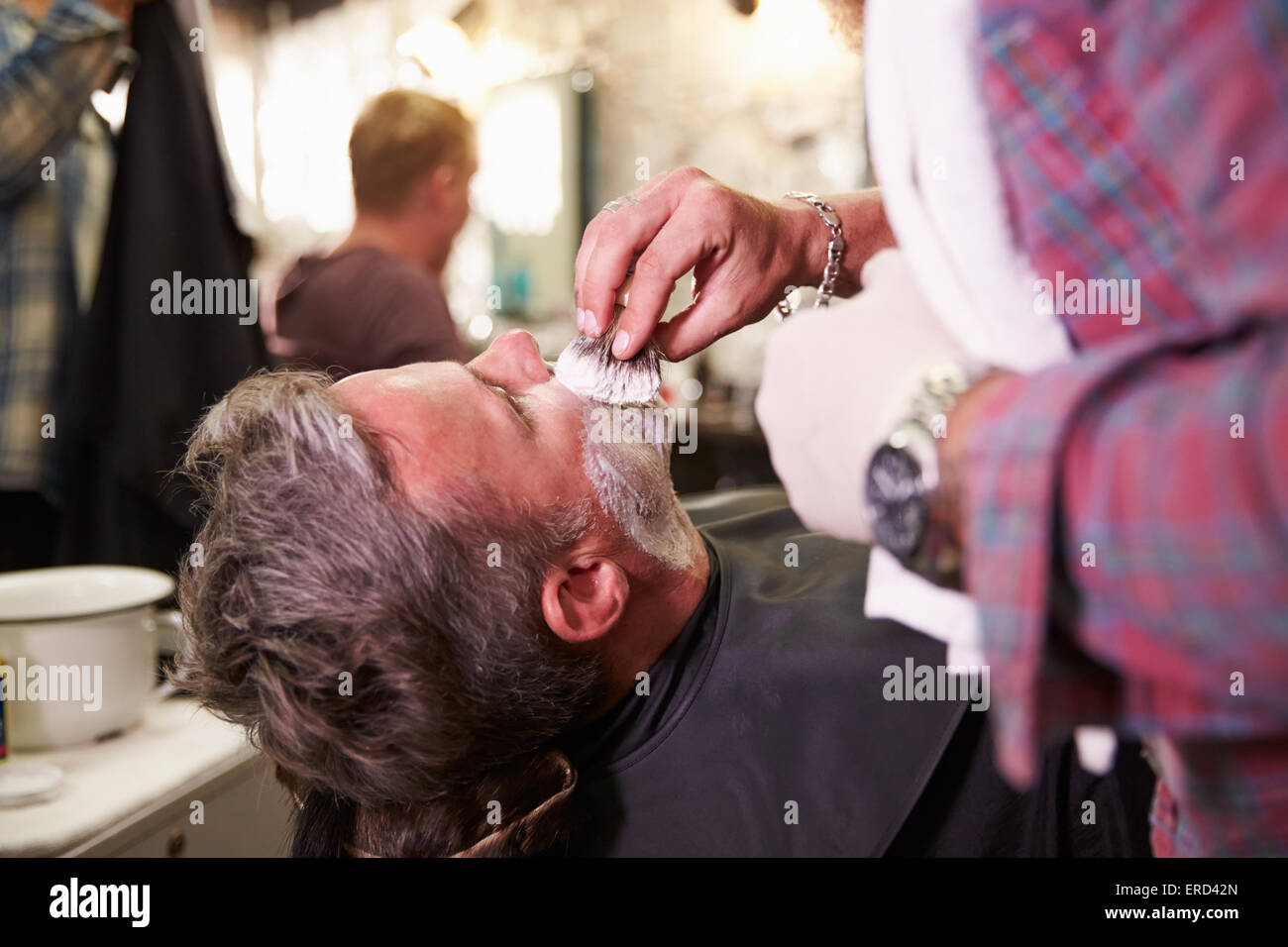 Male Barber Preparing Client For Shave In Shop Stock Photo - Alamy