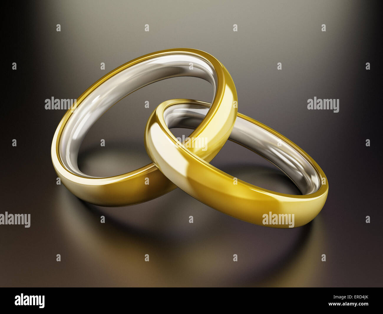 Wedding rings on black reflective surface Stock Photo - Alamy