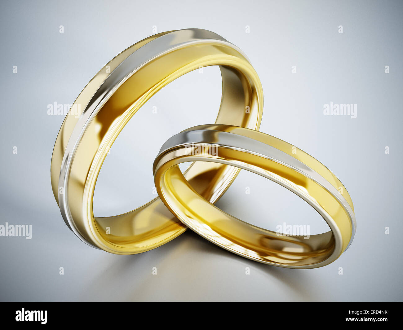 Wedding rings on white reflective surface Stock Photo - Alamy