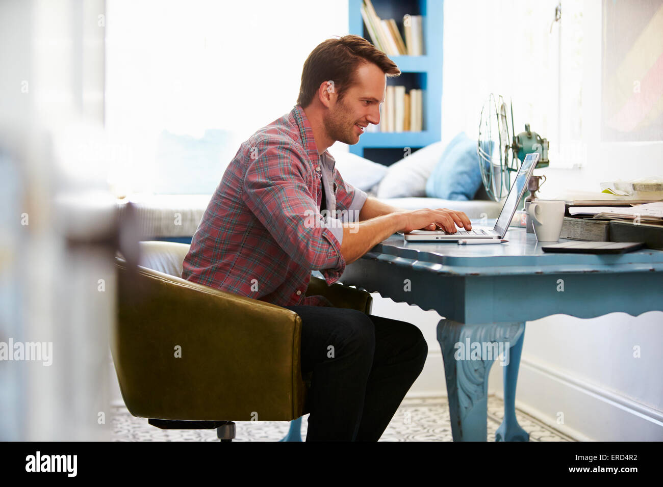 Man At Desk Working In Home Office With Laptop Stock Photo - Alamy