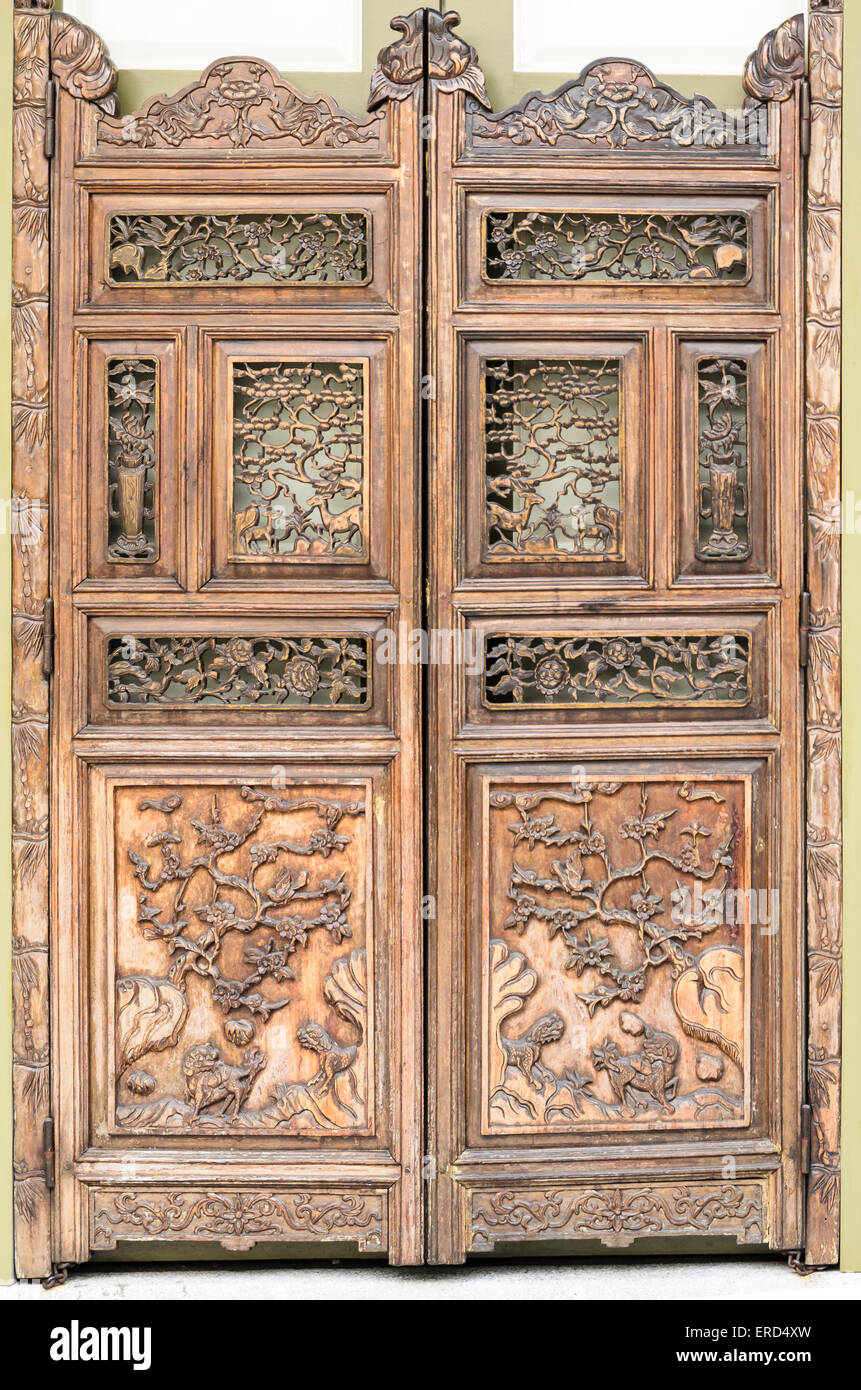 Peranakan carved wooden doors on a Baba-Nonya shophouse, Singapore ...