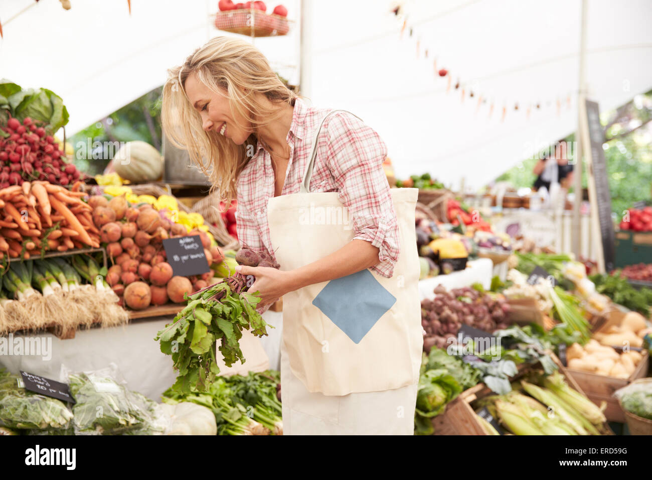 Female Customer Shopping At Farmers Market Stall Stock Photo - Alamy