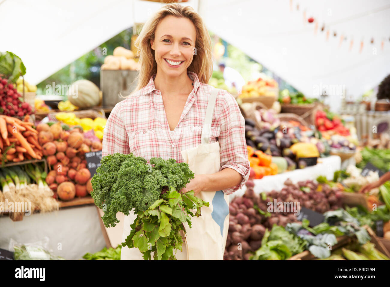 Smiling woman stall holder hi-res stock photography and images - Alamy