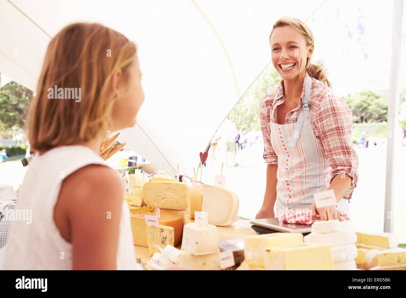 Woman Selling Fresh Cheese At Farmers Food Market Stock Photo - Alamy