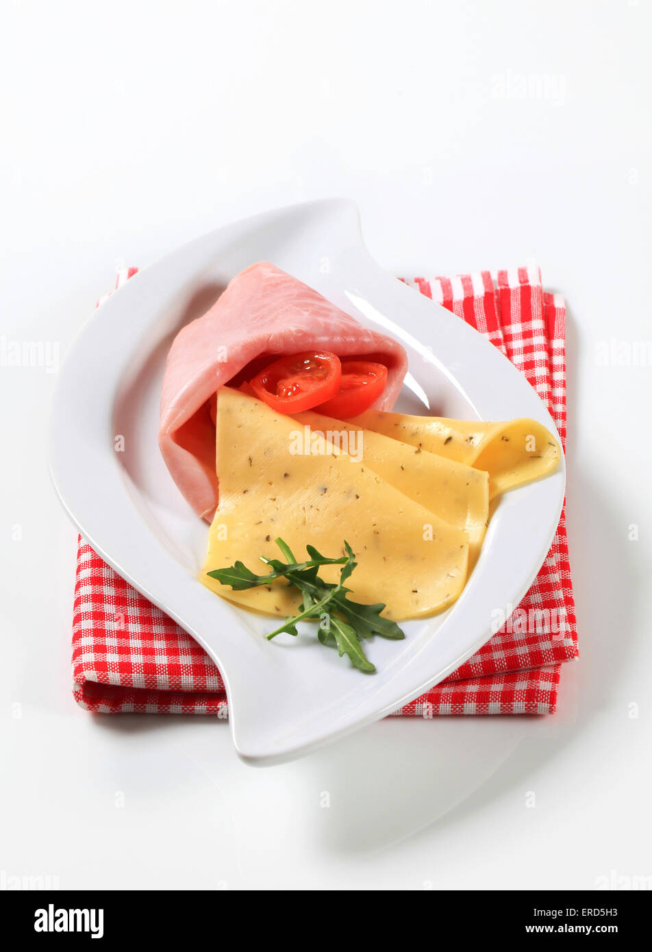 Thinly sliced ham and cheese on a plate Stock Photo - Alamy