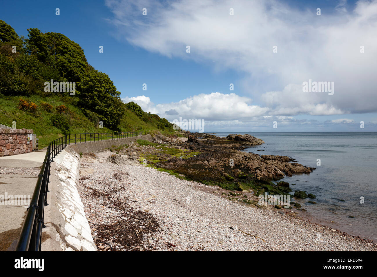 Cushendall beach and rocky shoreline County Antrim Northern Ireland UK ...