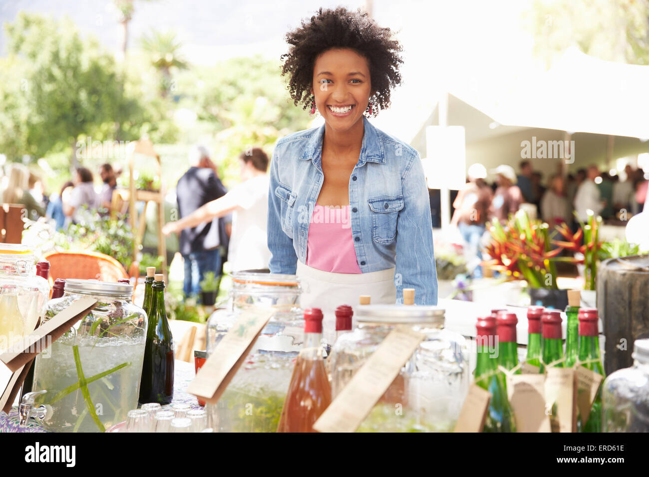 Woman Selling Soft Drinks At Farmers Market Stall Stock Photo - Alamy