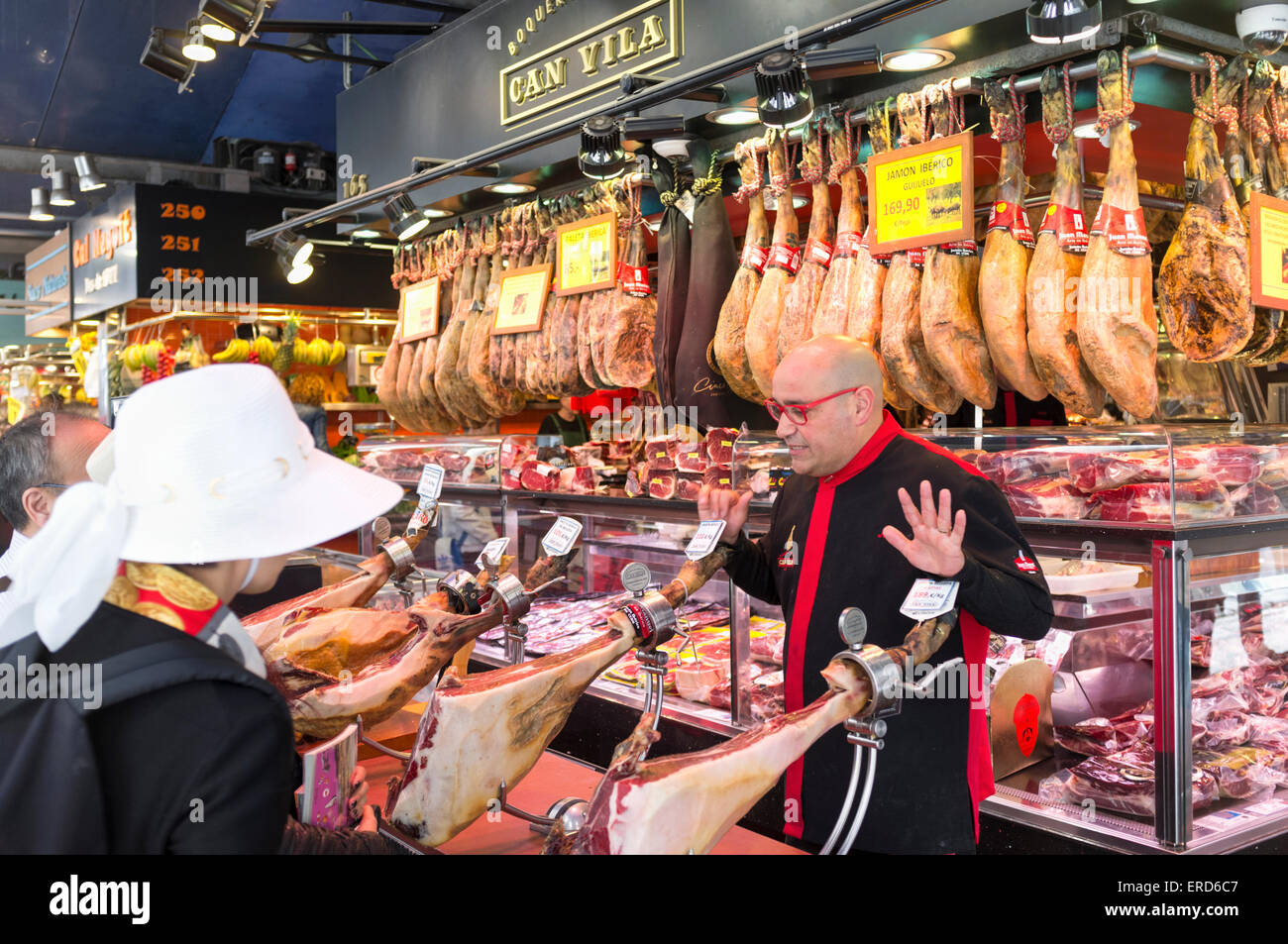 Serrano ham at La Boqueria market, Barcelona, Spain Stock Photo - Alamy