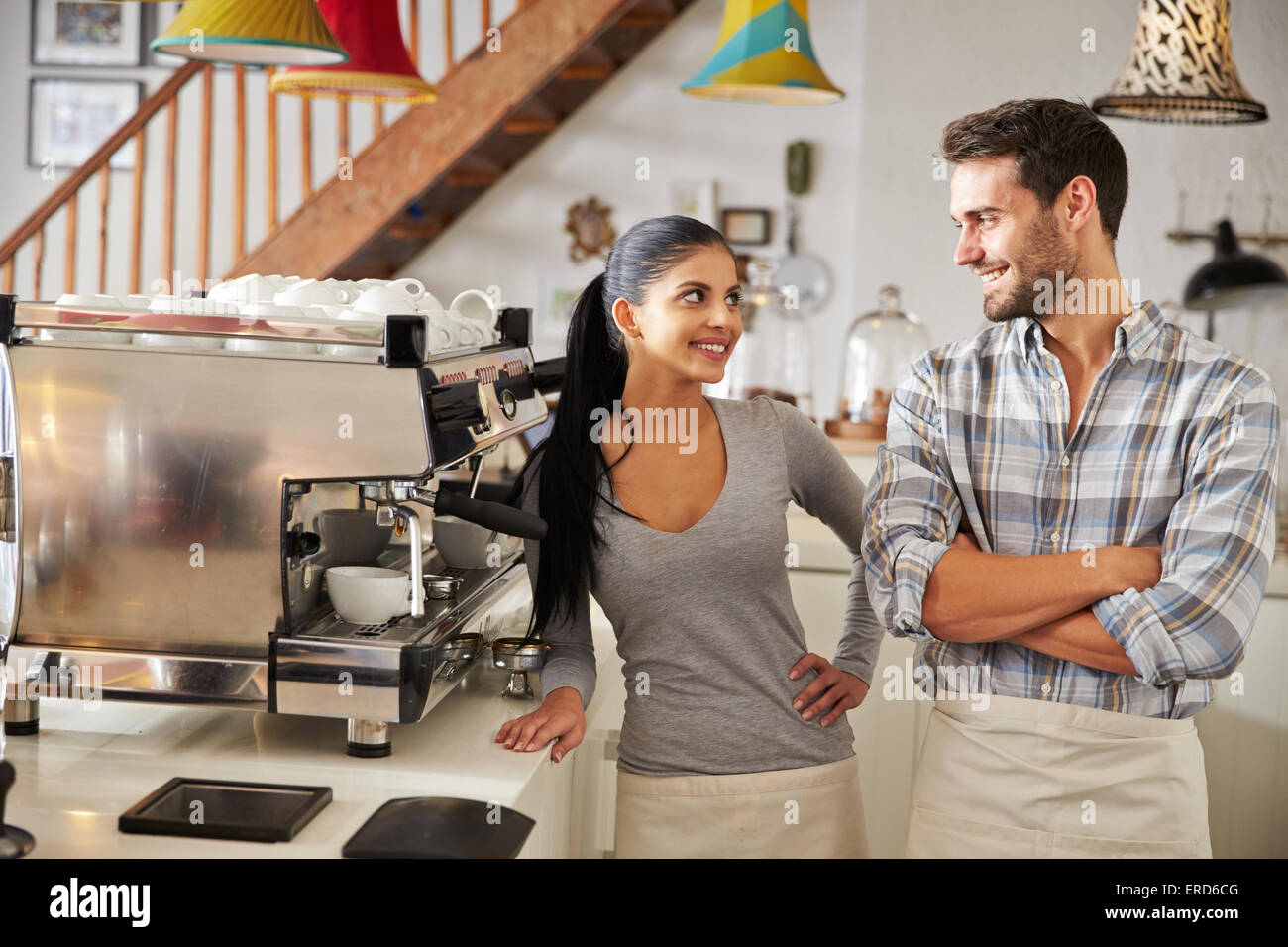 Happy cafe workers Stock Photo - Alamy