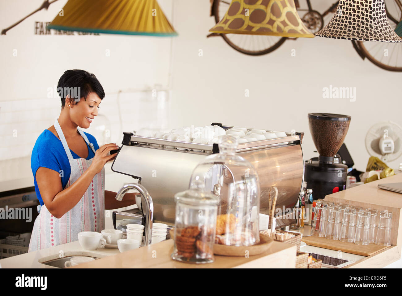 Cafe worker making coffee Stock Photo - Alamy