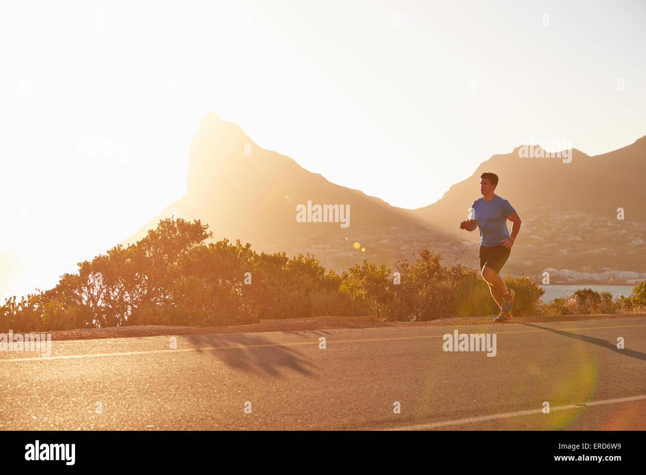 Young man running Stock Photo - Alamy