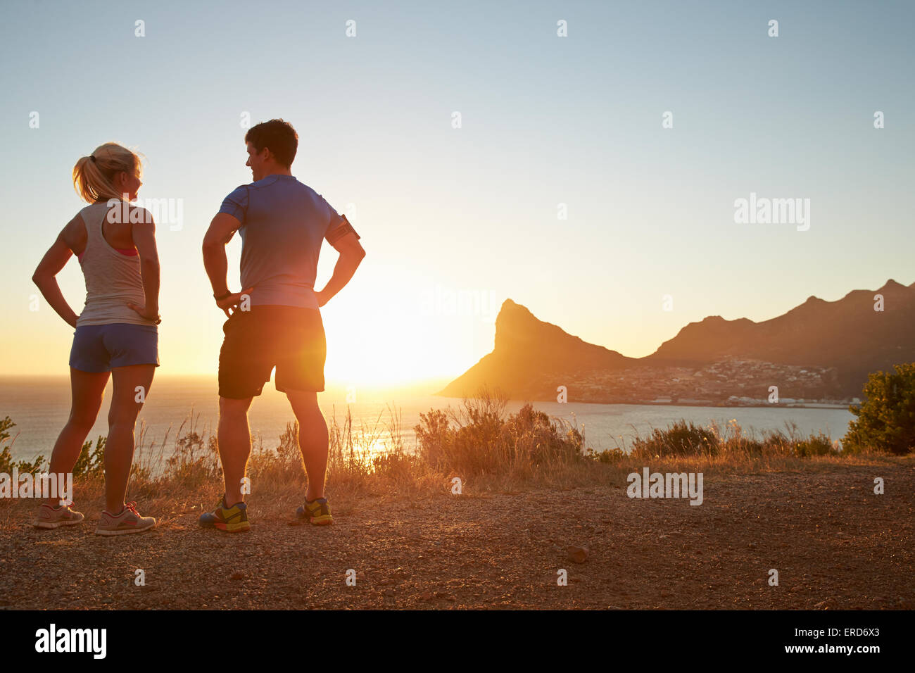 Man and woman talking after jogging Stock Photo - Alamy