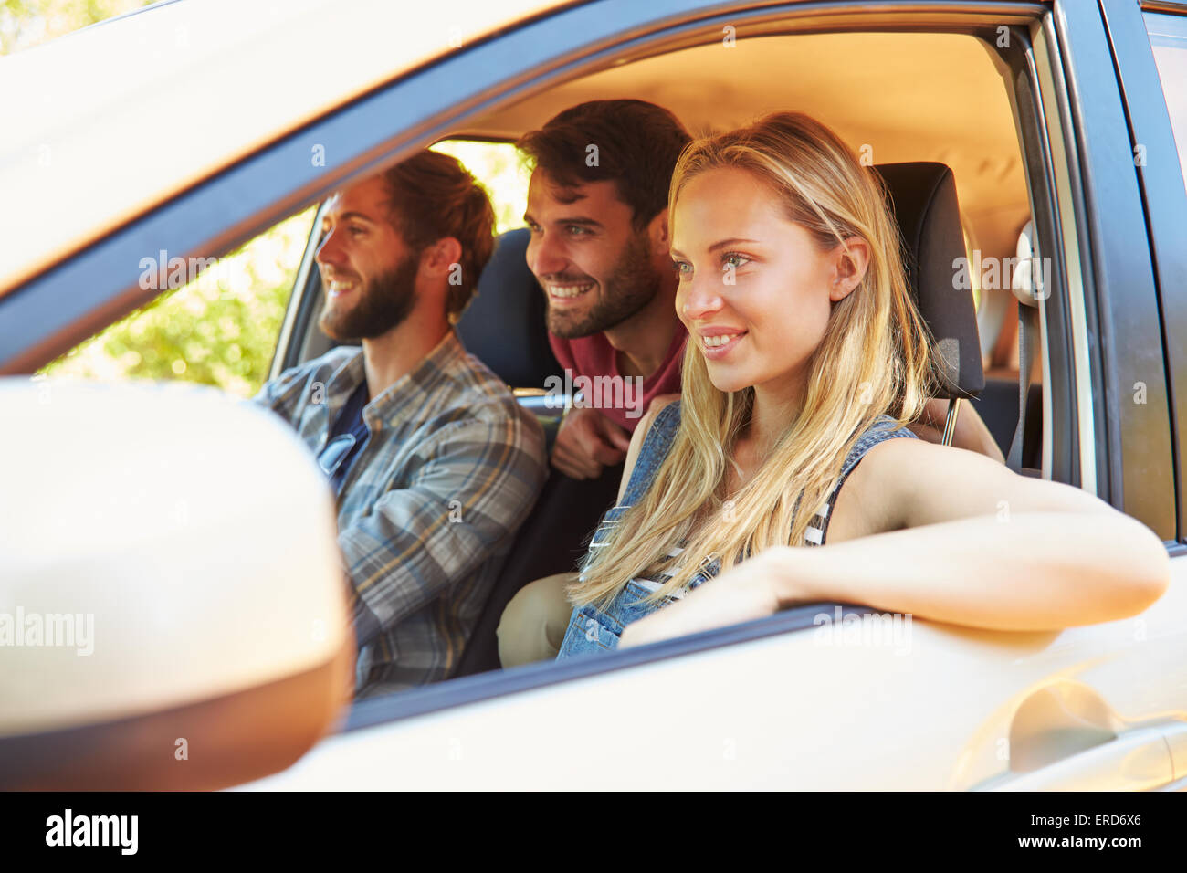 Group Of Friends In Car On Road Trip Together Stock Photo - Alamy