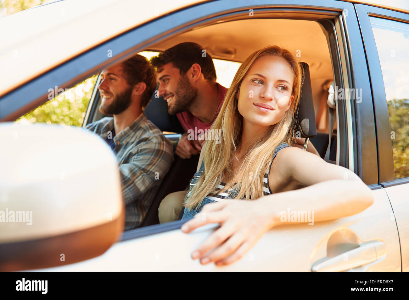 Group Of Friends In Car On Road Trip Together Stock Photo - Alamy