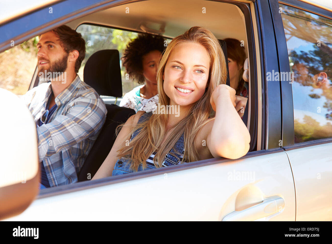 Group Of Friends In Car On Road Trip Together Stock Photo - Alamy