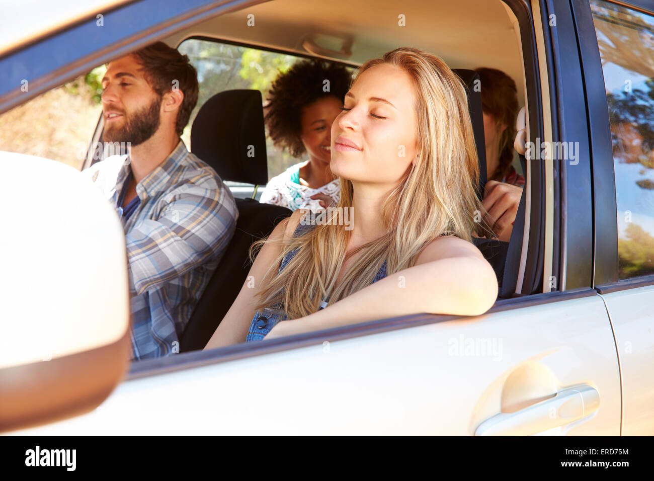 Group Of Friends In Car On Road Trip Together Stock Photo - Alamy