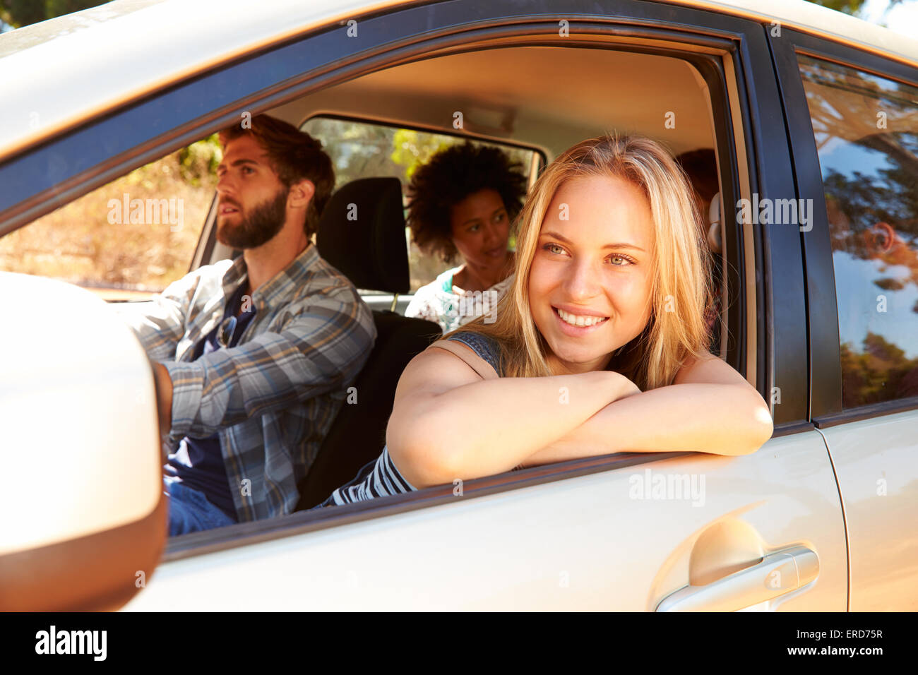 Group Of Friends In Car On Road Trip Together Stock Photo - Alamy