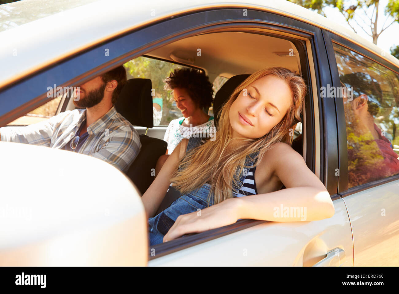 Group Of Friends In Car On Road Trip Together Stock Photo - Alamy