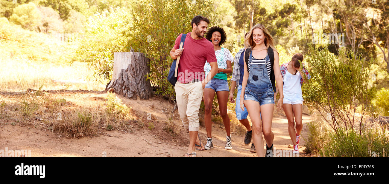 Group Of Friends On Walk Through Countryside Together Stock Photo - Alamy