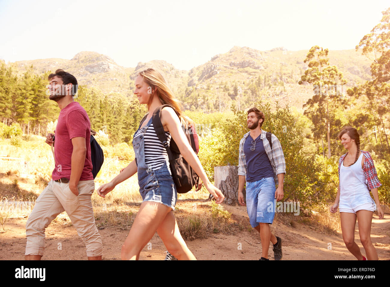 Group Of Friends On Walk Through Countryside Together Stock Photo - Alamy