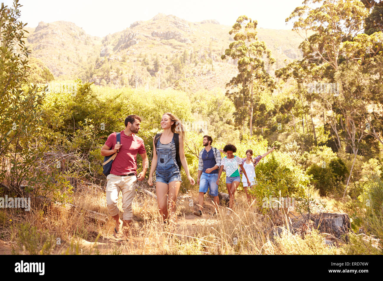 Group Of Friends On Walk Through Countryside Together Stock Photo - Alamy
