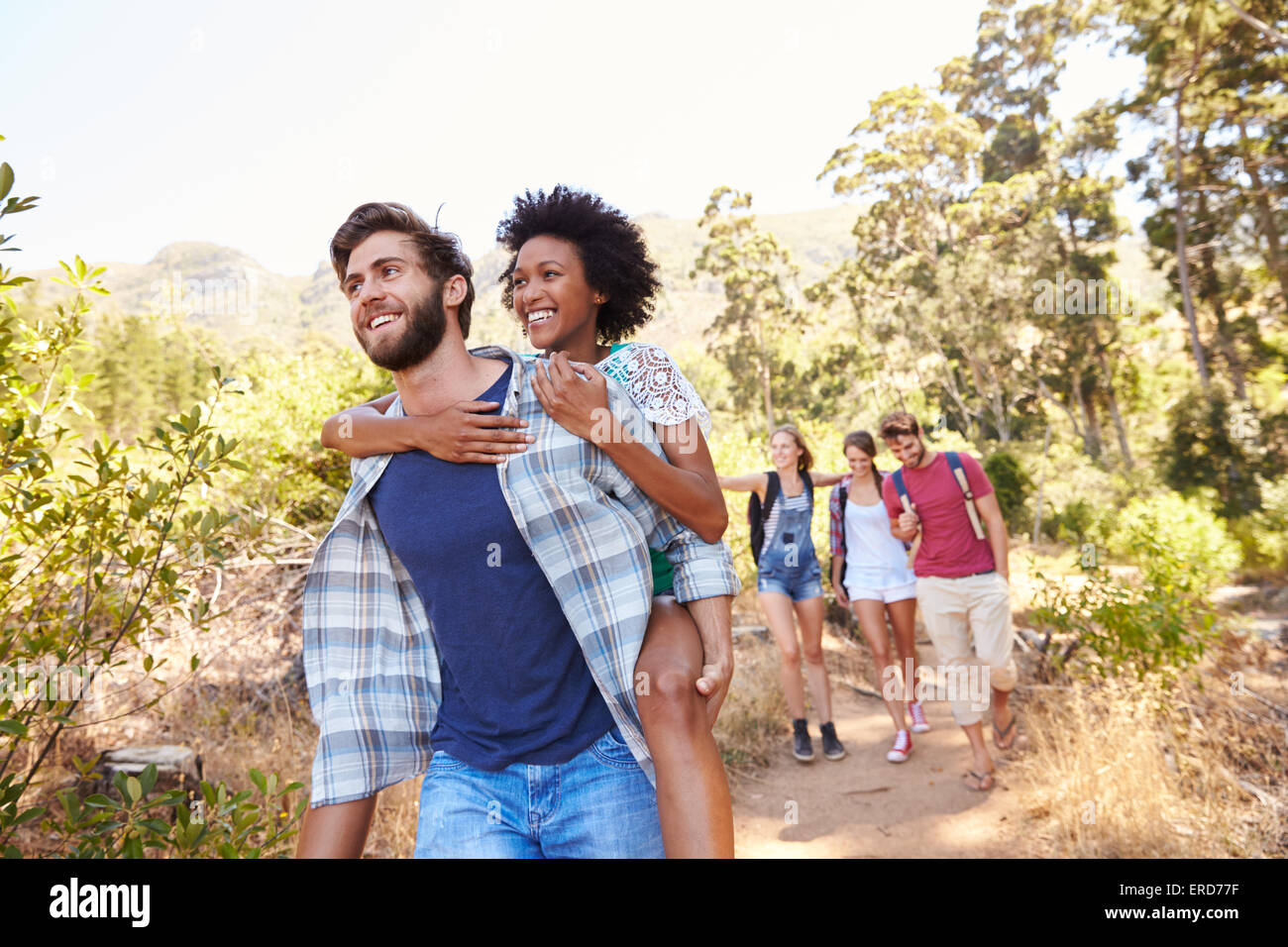Group Of Friends On Walk Through Countryside Together Stock Photo - Alamy